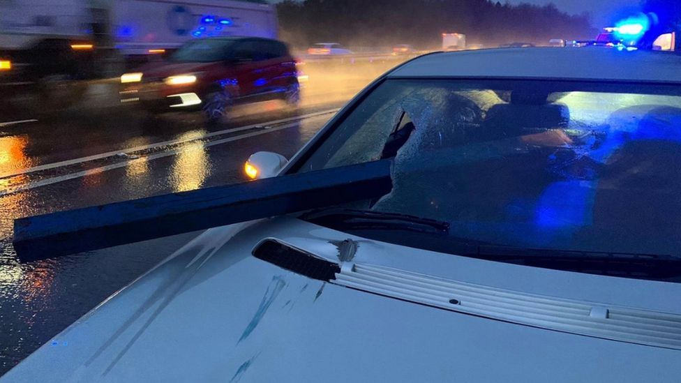 M4: Driver taken to hospital after metal post hits car - BBC News