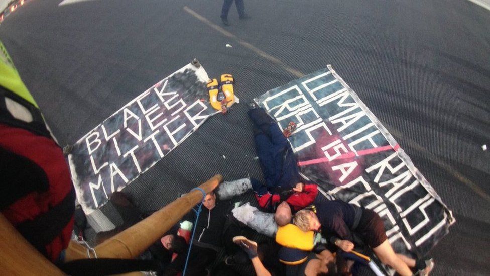 Black Lives Matter protesters close London City Airport runway - BBC News