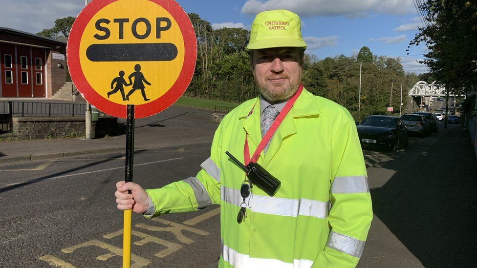 Crumlin school principal steps in as a lollipop man - BBC News