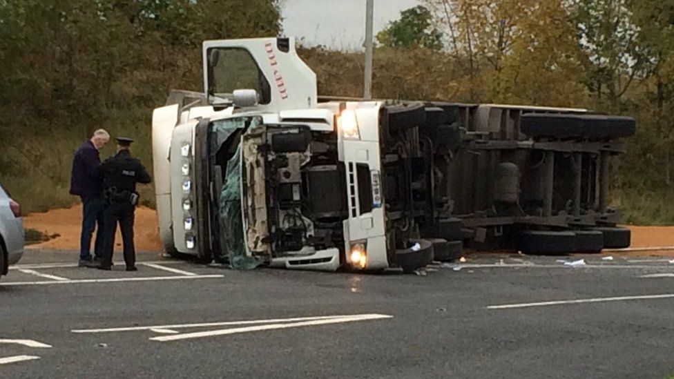 Portadown: M12 delays after grain lorry overturns - BBC News