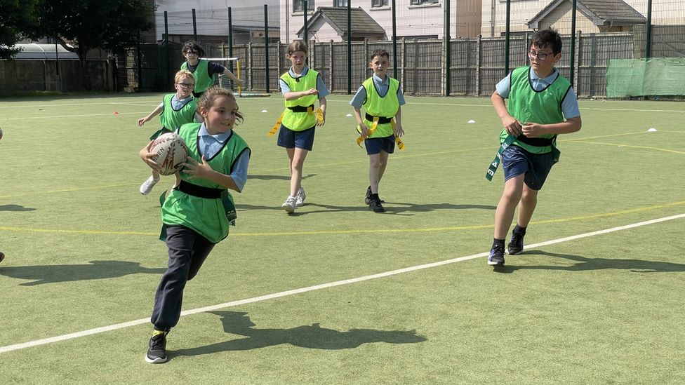 Jersey coach hopes Reds inspires new tag rugby players - BBC News