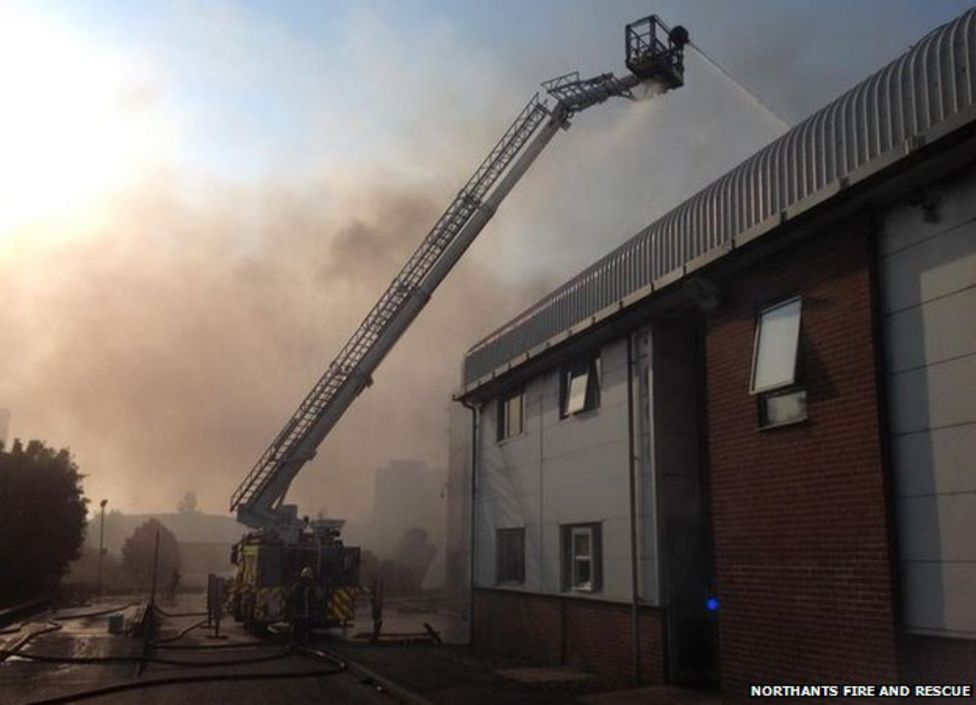Corby warehouse blaze fought by 80 firefighters - BBC News