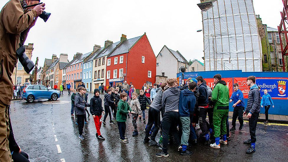 In pictures: Jedburgh ba' game takes to the streets - BBC News
