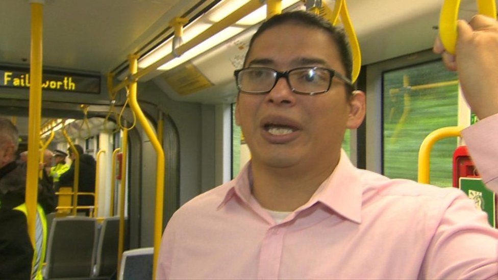 Three in court over alleged Manchester tram racist abuse - BBC News