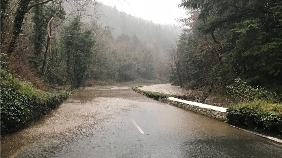 Isle of Man roads 'impassable' after heavy rain causes flooding - BBC News