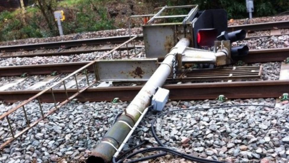 Rail report finds corrosion caused signal post to fall onto lines near ...