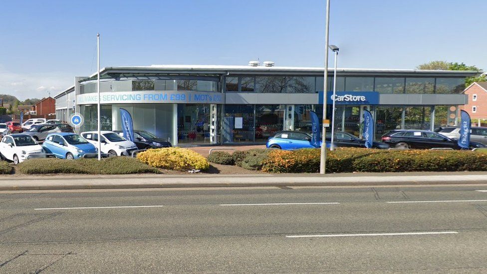Police vehicle rammed by car stolen from showroom - BBC News