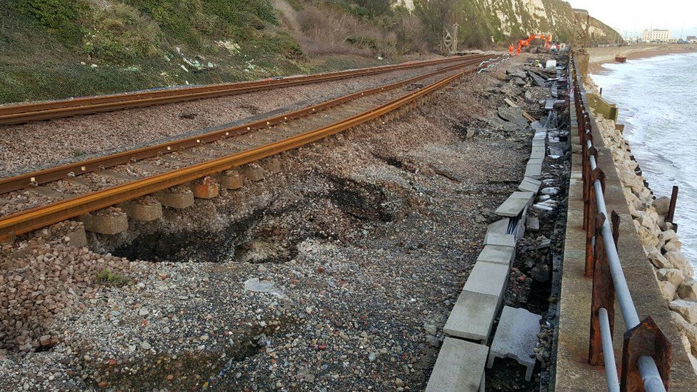 Dover rail line reopens after sea wall collapse - BBC News