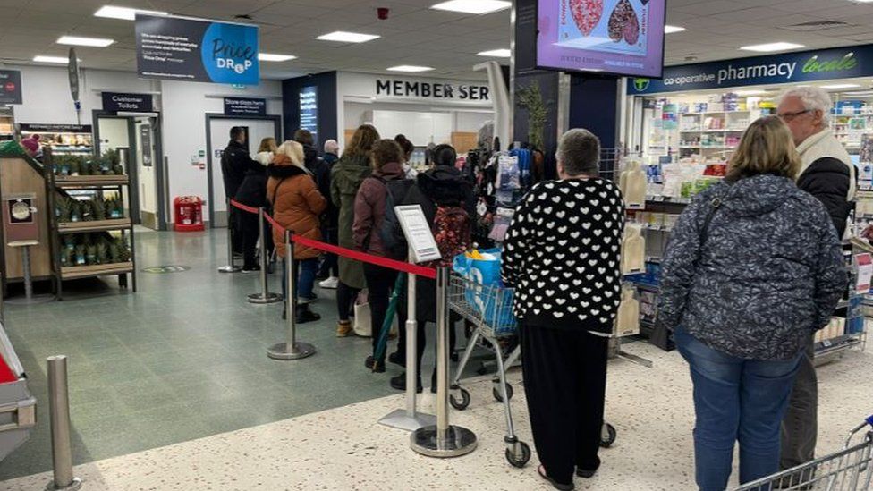 CI Coop customers queue for cash after dividend alert - BBC News