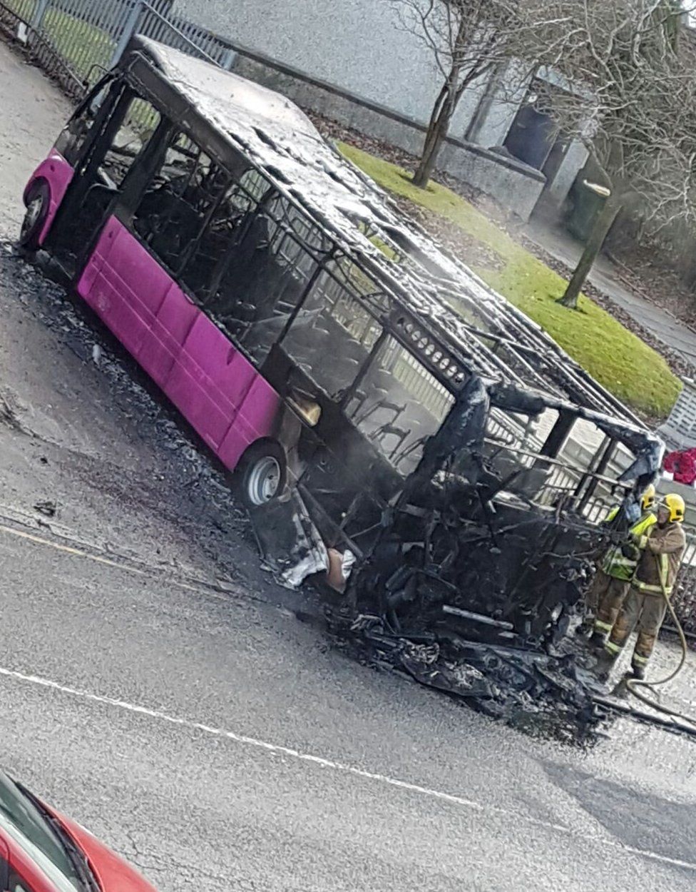 Bus completely destroyed by fire near Motherwell - BBC News