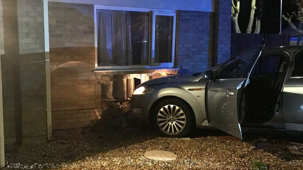 Car removed a week after Peterborough house crash - BBC News