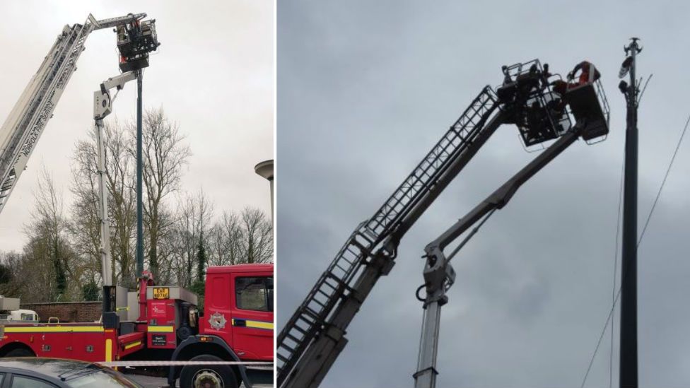 Norwich cherry picker workers rescued after sky-high breakdown - BBC News