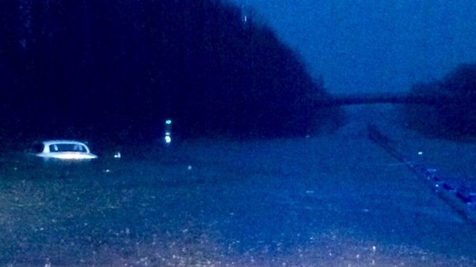 Homes evacuated and A5 and A55 shut in north Wales floods - BBC News