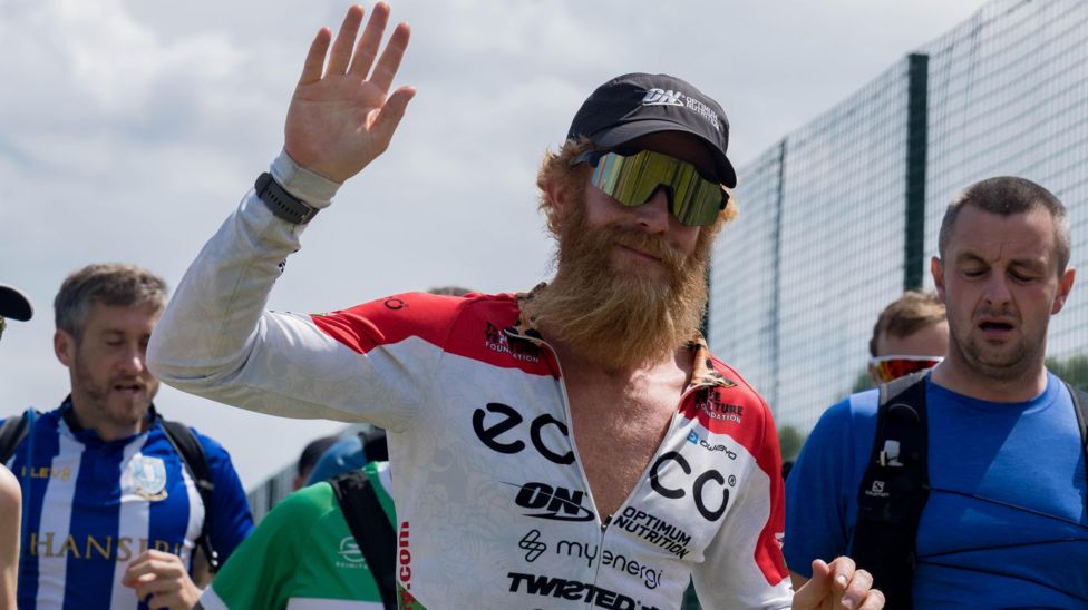 Flintshire: Man breaks ultra endurance triathlon record - BBC News