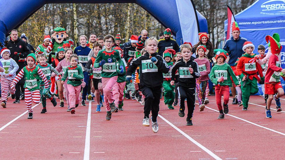 Hundreds of Santa's elves raise money for mental health charity - BBC News