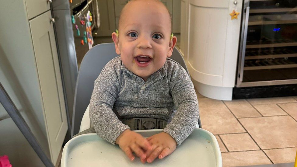 Peterborough family celebrates baby Luca with charity walk - BBC News