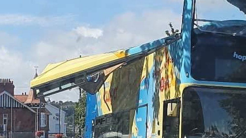 Mumbles: Two in hospital after open-top bus crash - BBC News