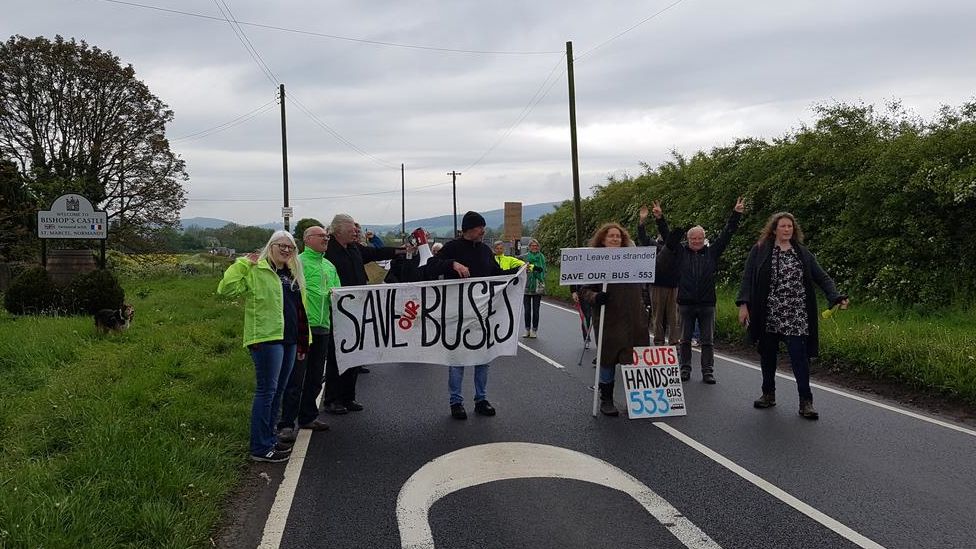 Bishops Castle road blocked during bus cuts protest - BBC News