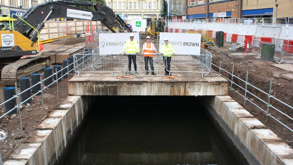 Cardiff canal hidden for 70 years uncovered in city centre - BBC News