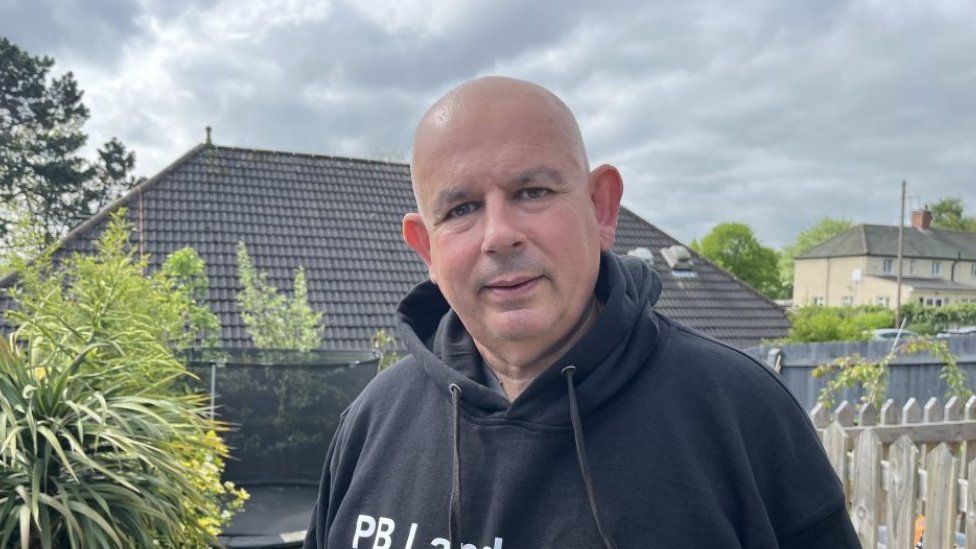 Boy with amputated limbs gets accessible garden makeover - BBC News