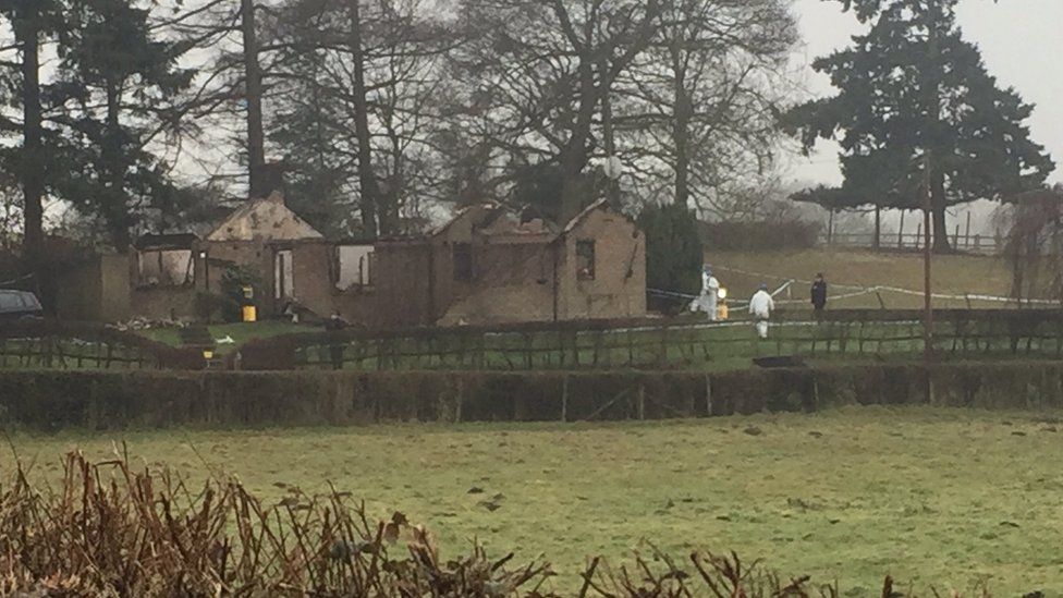 Child among three bodies found after Reigate house fire - BBC News