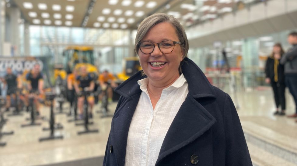 Staffordshire JCB staff cycle 'around world' to help woman with cancer ...