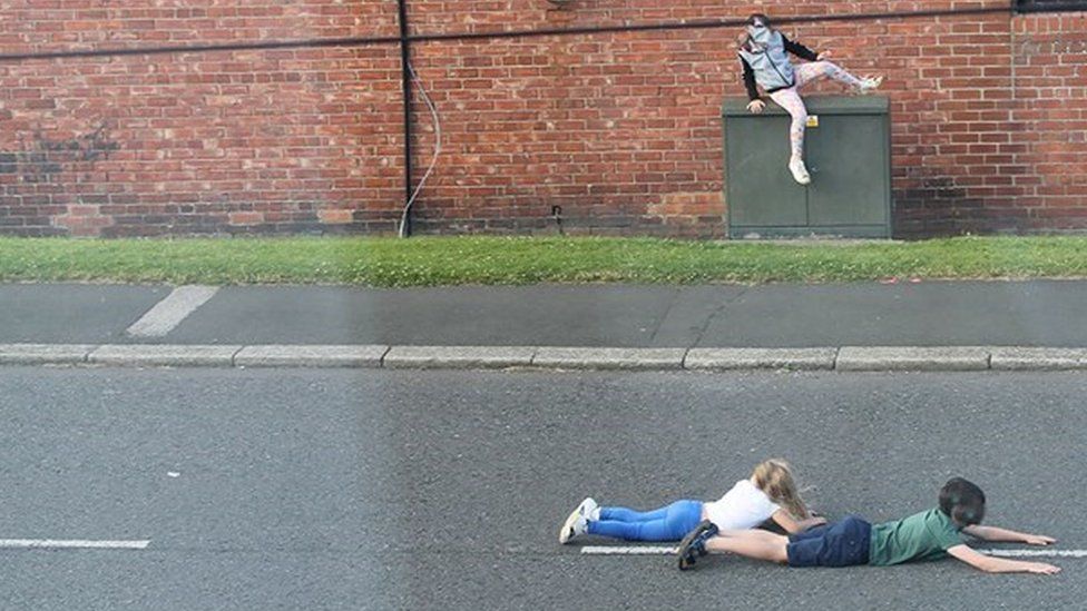 Police release 'unbelievable' child road play photos - BBC News