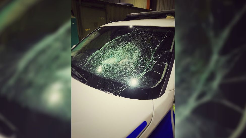 Police windscreen smashed by swede in Devon - BBC News
