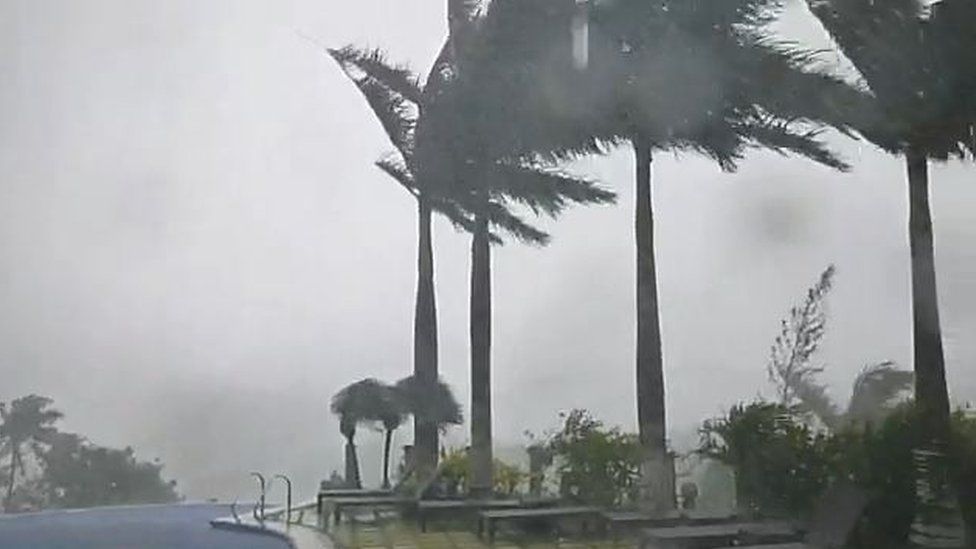 'There's a typhoon outside my hotel room' - BBC News