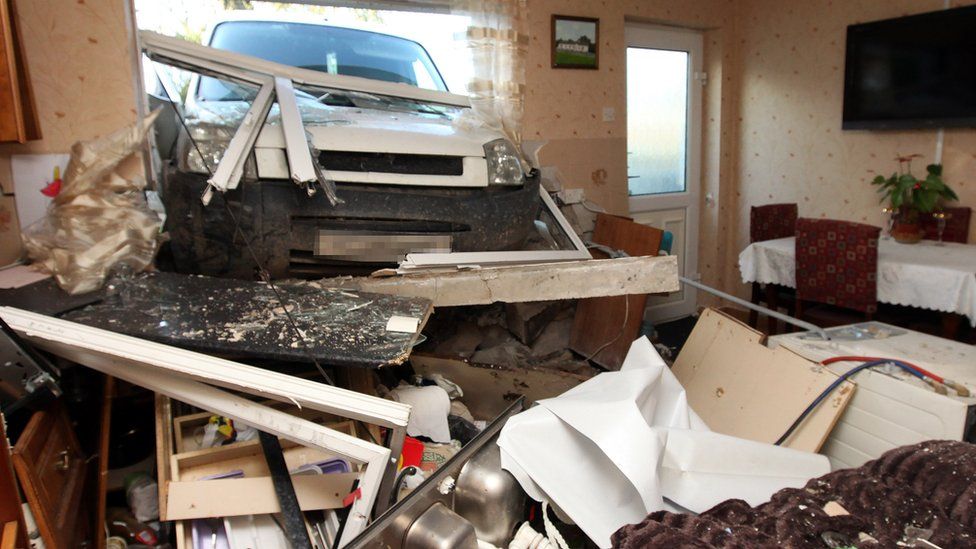 Waringstown: Woman injured as van crashes into kitchen - BBC News