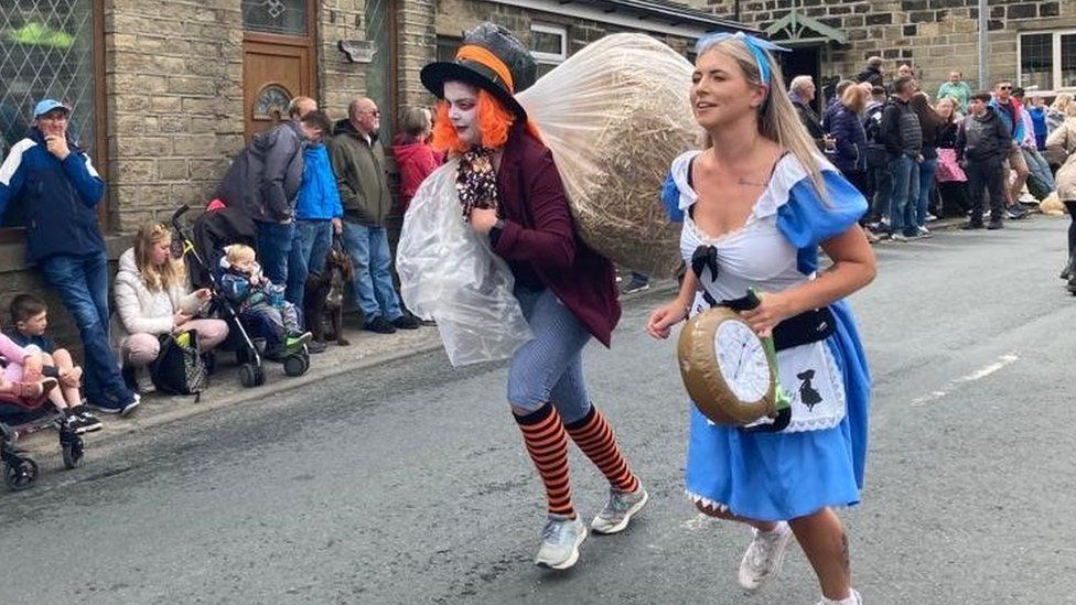 Oxenhope Straw Race: Pints and perspiration at annual bale race - BBC News