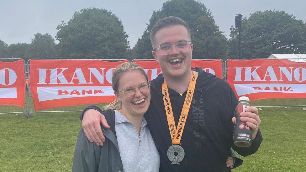 Man finishes half marathon four years after collapse - BBC News