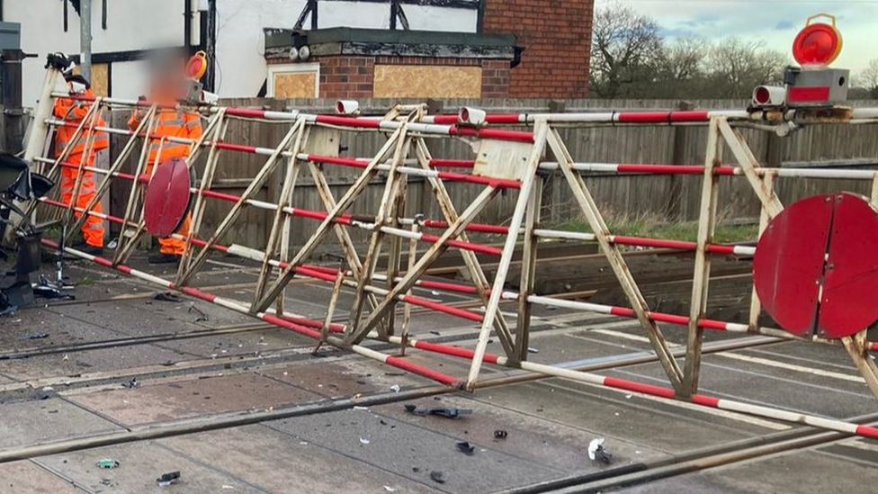 Hilton level crossing due to reopen after gates damaged in crash - BBC News
