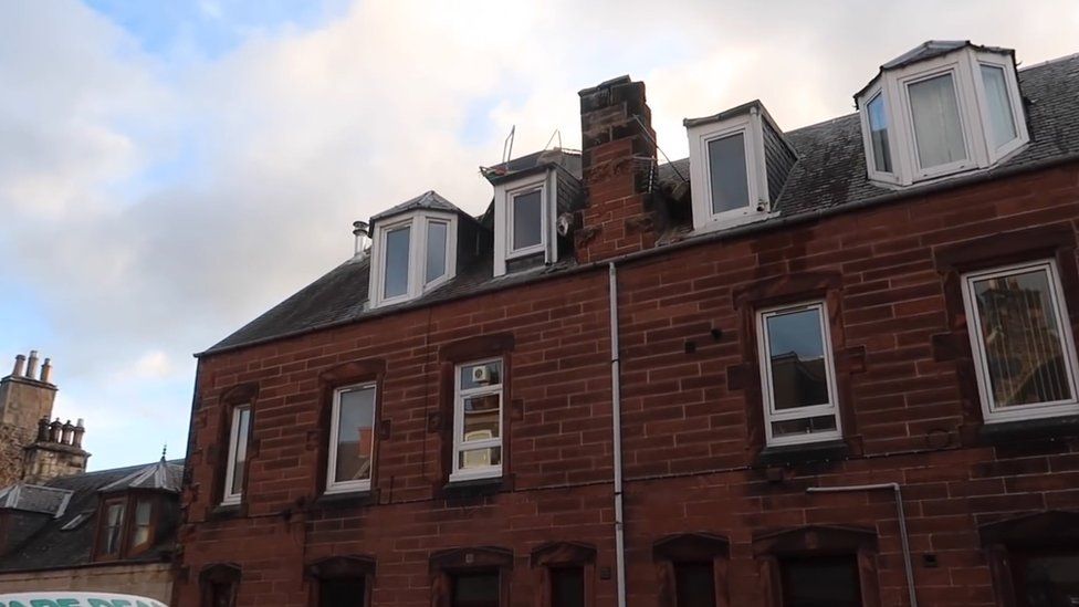 Firefighters rescue trampoline from roof of Galashiels house - BBC News
