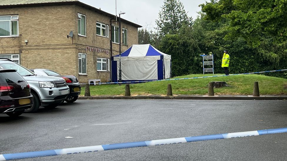 Woman and boy, 16, charged with murdering man found at Coventry flat ...