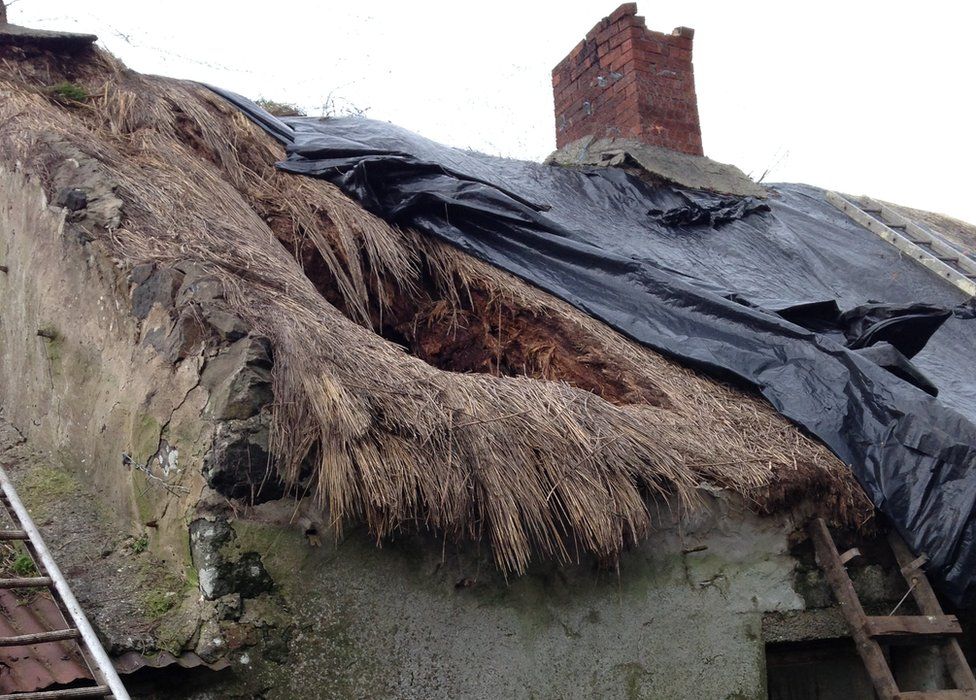 Pensioners' listed thatched cottage 'falling down around them' - BBC News