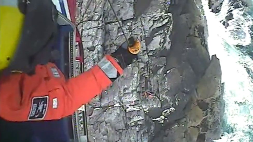 Man rescued after kayak overturns - BBC News