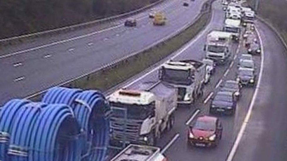 M4 reopens after crash leaves motorcyclist critical - BBC News