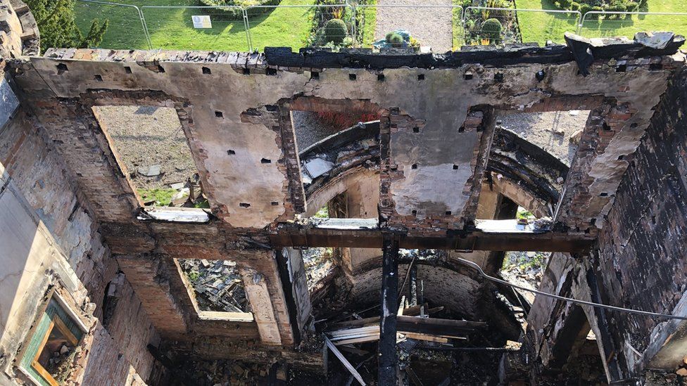 Initial rebuild nears end at fire-hit Betley Court - BBC News