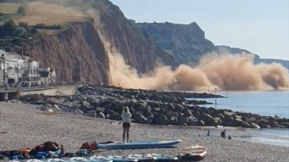 Sidmouth cliff falls send clouds of dust into air - BBC News