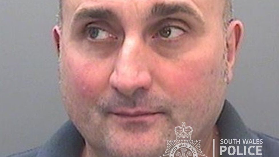 Tonypandy police-bribe officer Mark Hopkins jailed - BBC News