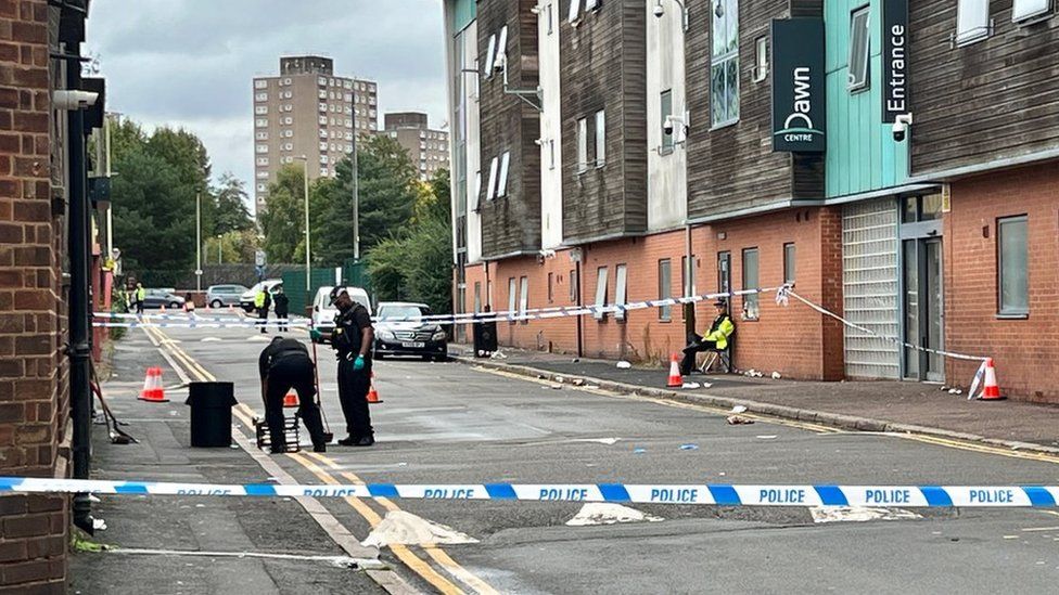 Vigil held for two men stabbed to death in Leicester - BBC News
