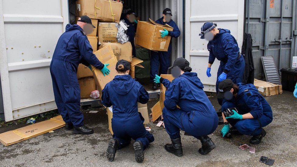 Police seize 70 tonnes of fake goods during Cheetham Hill raid - BBC News