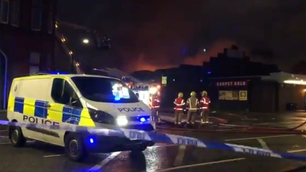 Fire rips through businesses in Old Trafford - BBC News