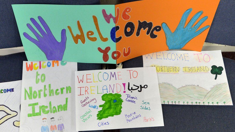 Syrian refugees: First families arrive in Northern Ireland - BBC News