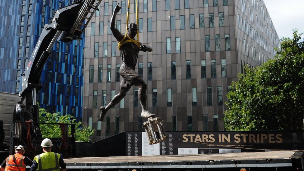 Alan Shearer statue moved to new home at St James' Park - BBC News