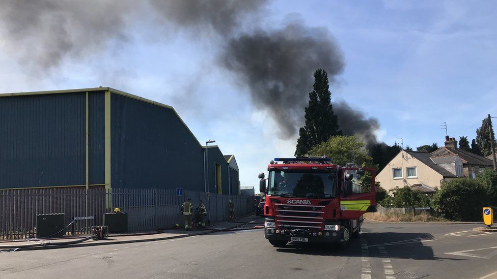 Firefighters tackle Wisbech wood warehouse blaze - BBC News