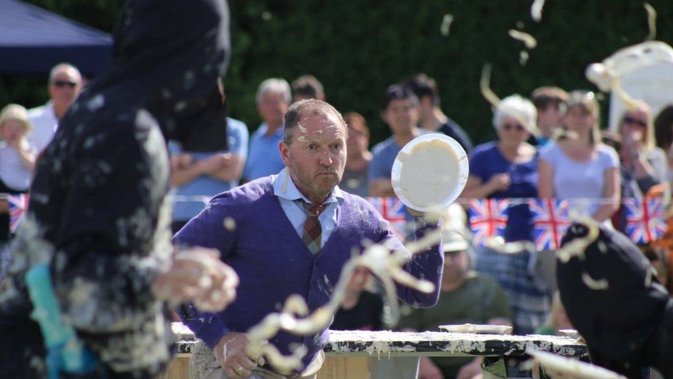 Teams compete for World Custard Pie Championship trophy - BBC News