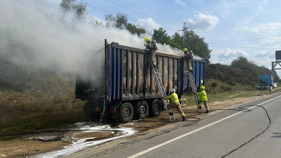 Fire crews tackle lorry fire on northbound A13 at Aveley - BBC News