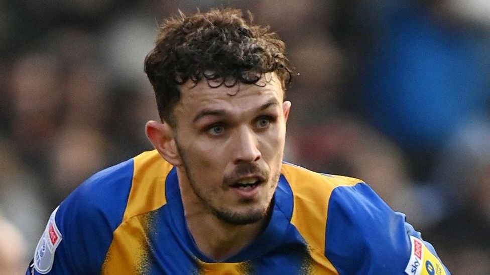 Tom Flanagan: Colchester sign former Shrewsbury defender - BBC Sport